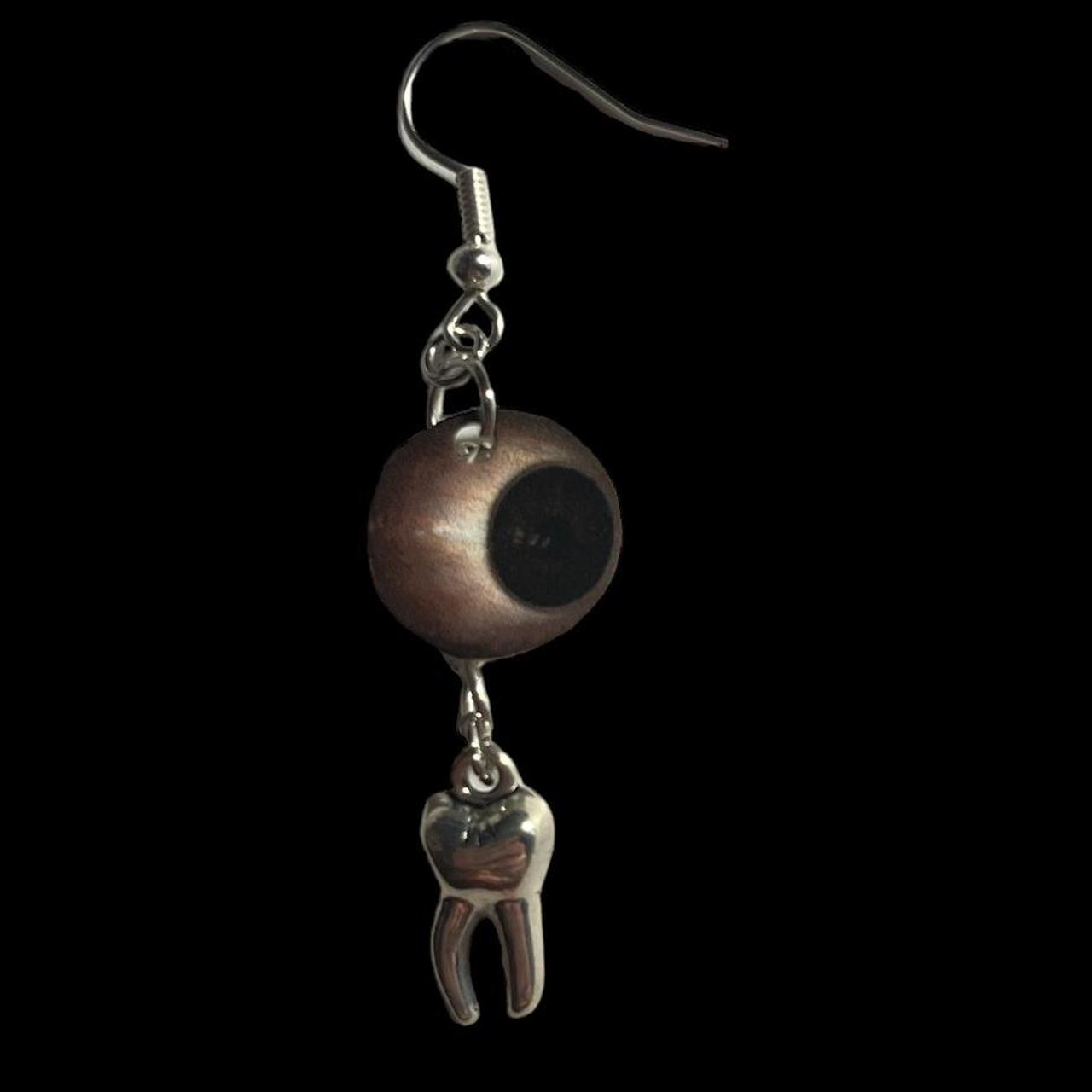 “brainless” creepy eye and tooth earring pair... - Depop