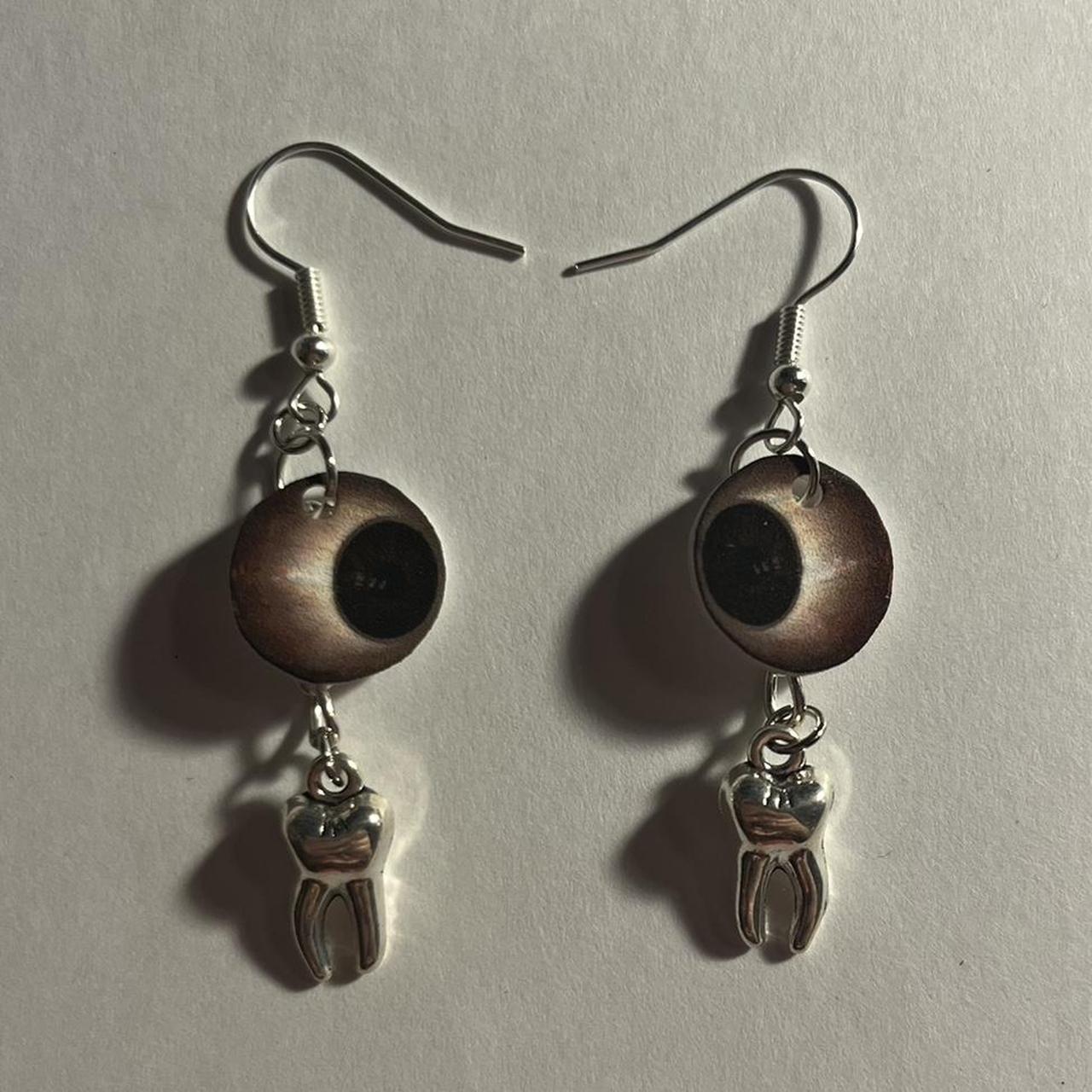 “brainless” creepy eye and tooth earring pair... - Depop