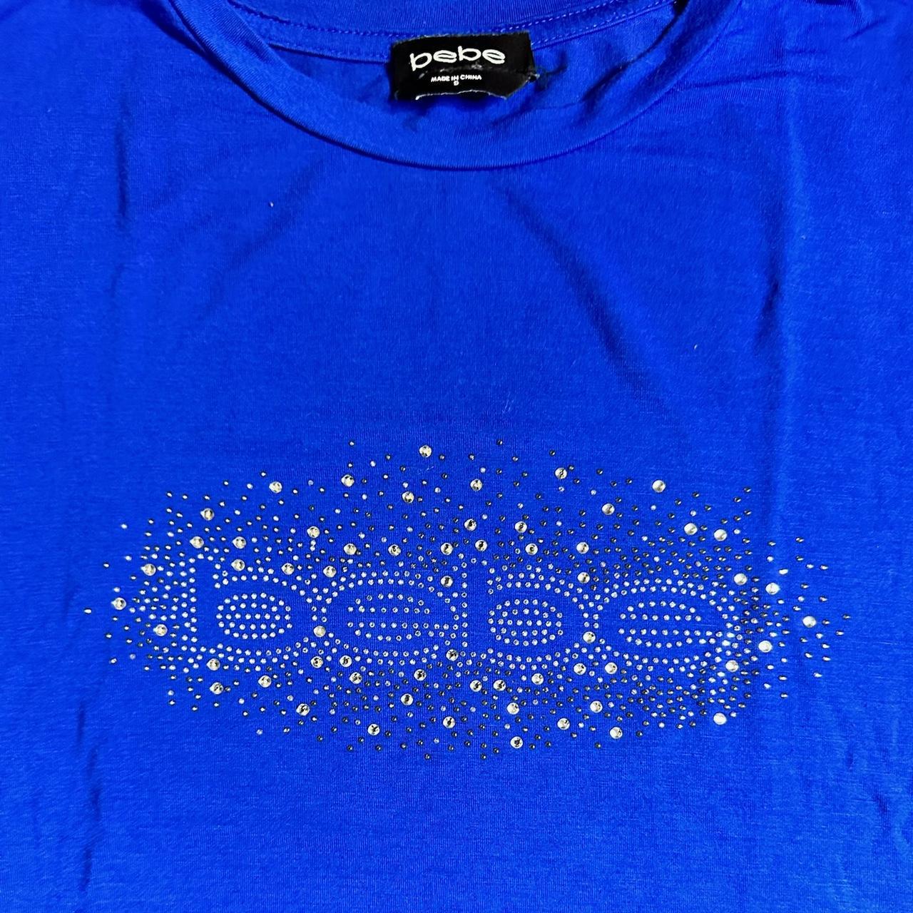 Bebe blue baby tee Size S. Could also fit a S/M... - Depop
