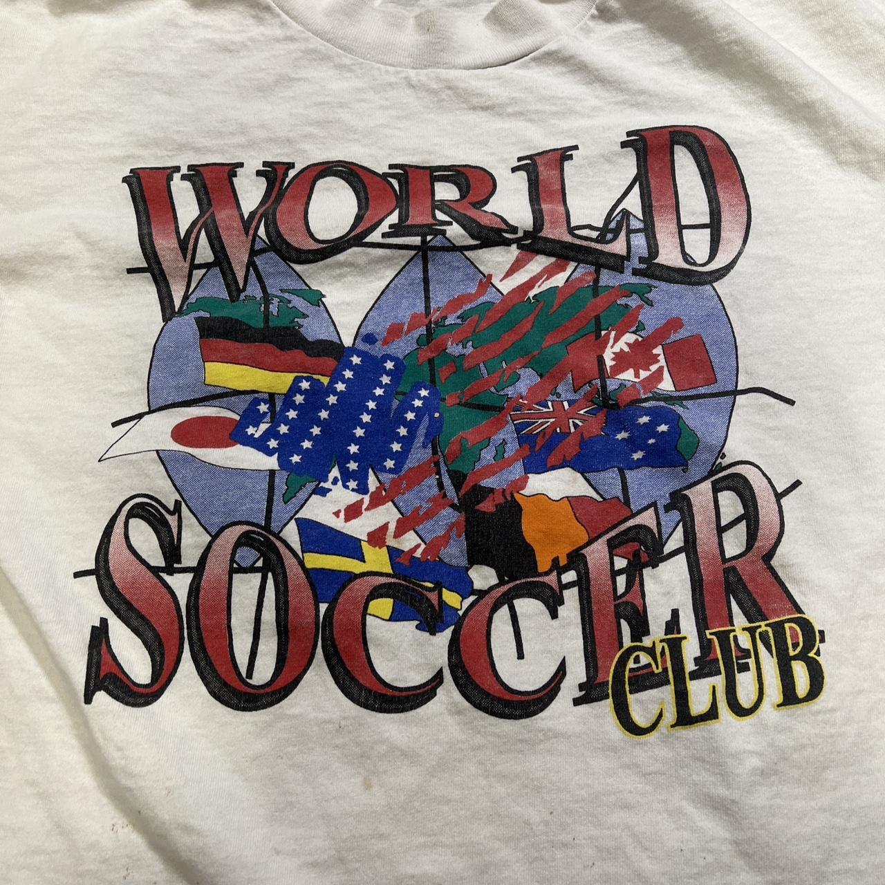 Early 2000s world soccer tee. One hole and one stain... - Depop