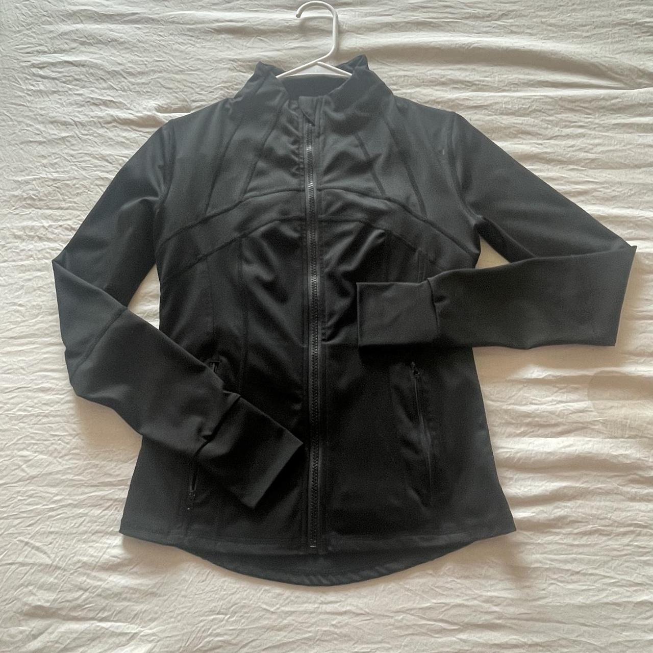 Black workout jacket with zip up pockets and thumb... - Depop
