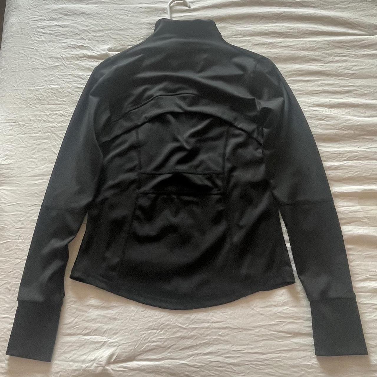 Black workout jacket with zip up pockets and thumb... - Depop