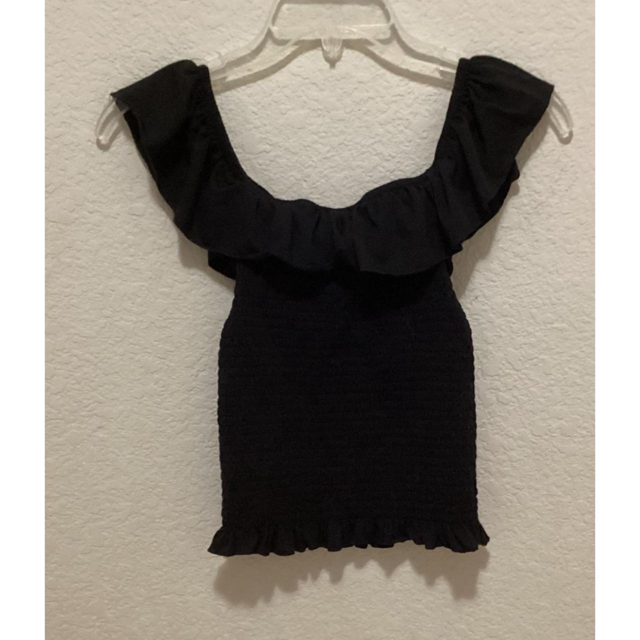 Ruffle detailing and off-shoulder design make this... | Depop