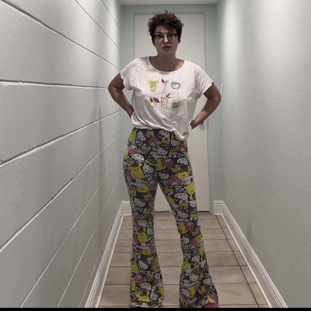 Hello Kitty flare pants size L. Slight pilling in... - Depop