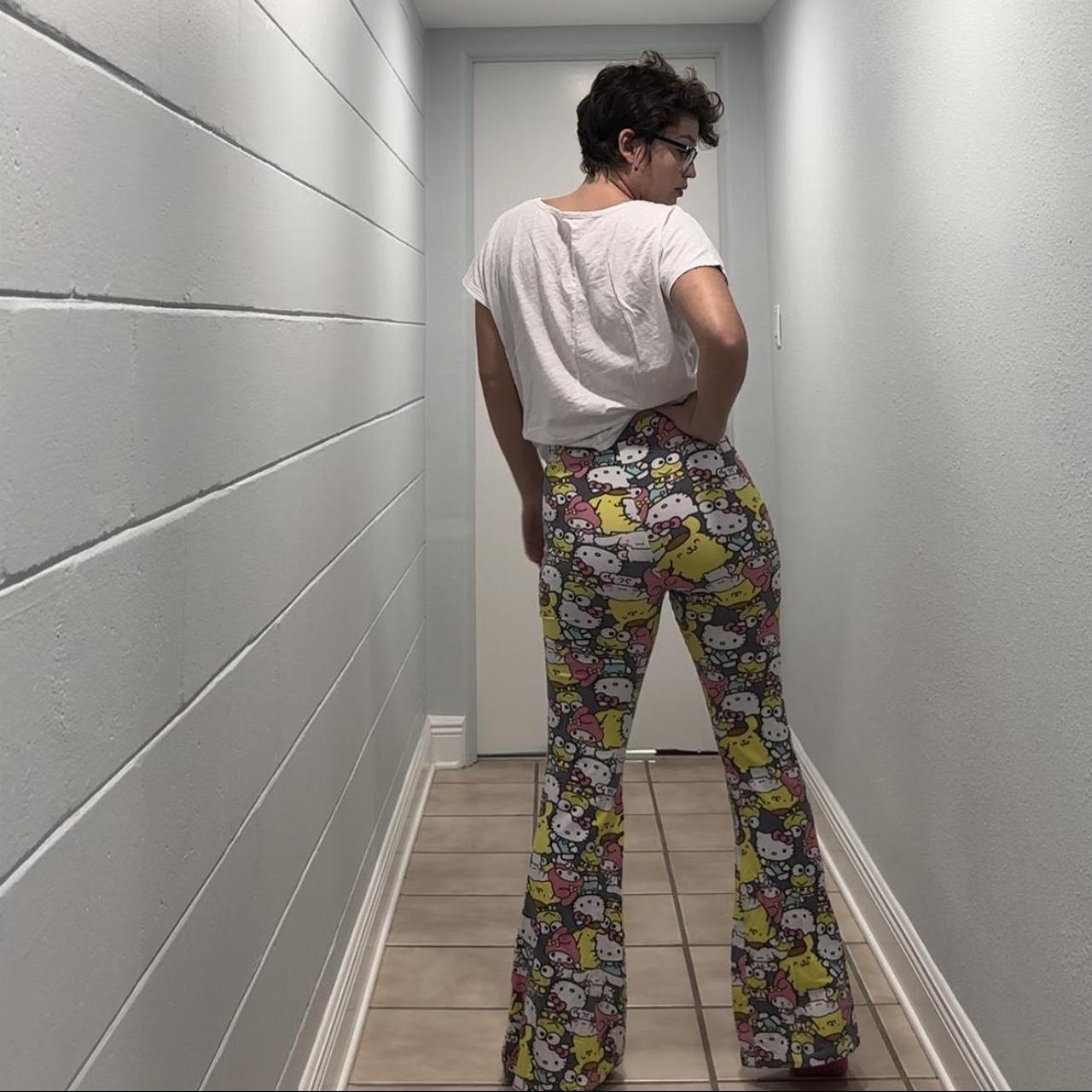Hello Kitty flare pants size L. Slight pilling in... - Depop