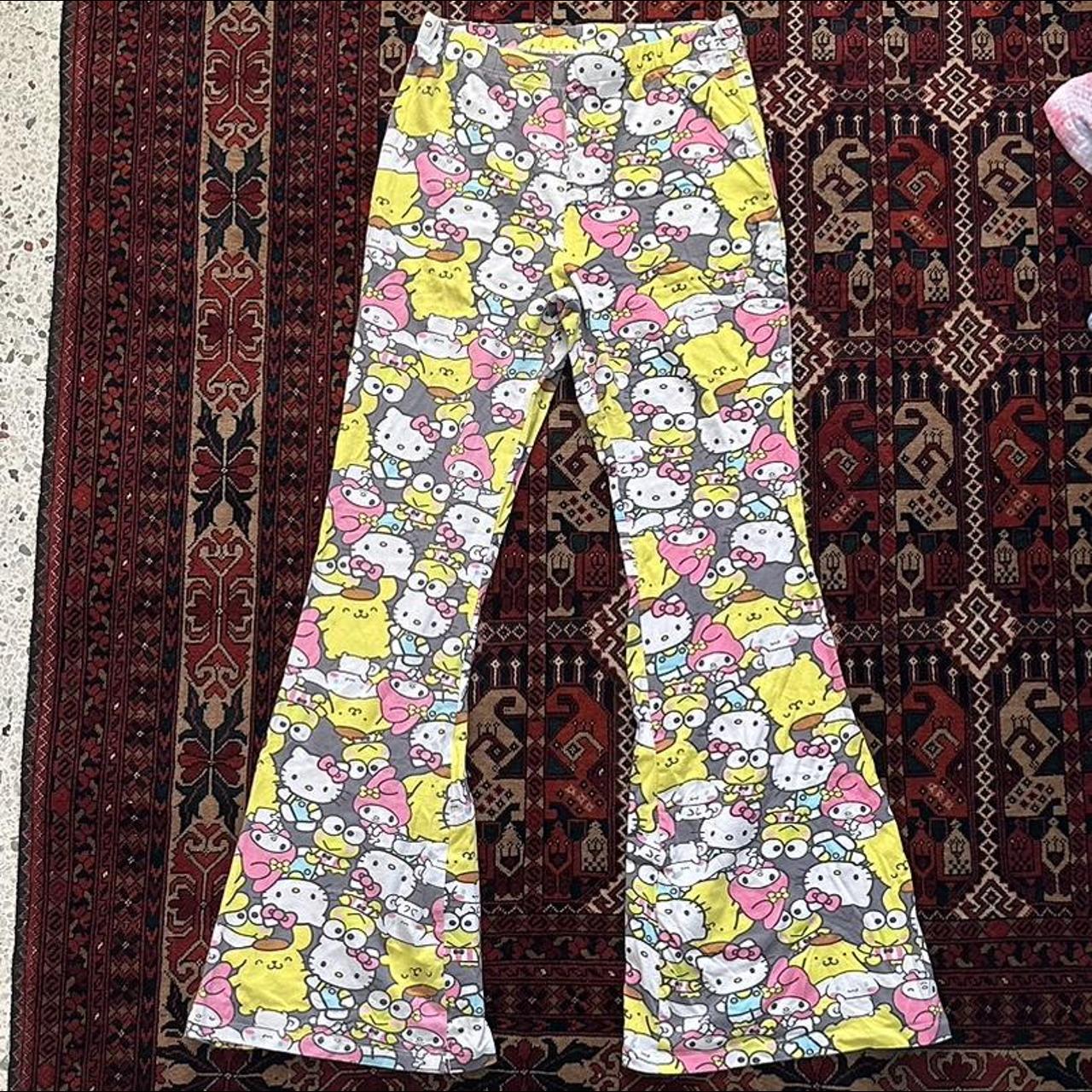 Hello Kitty flare pants size L. Slight pilling in... - Depop
