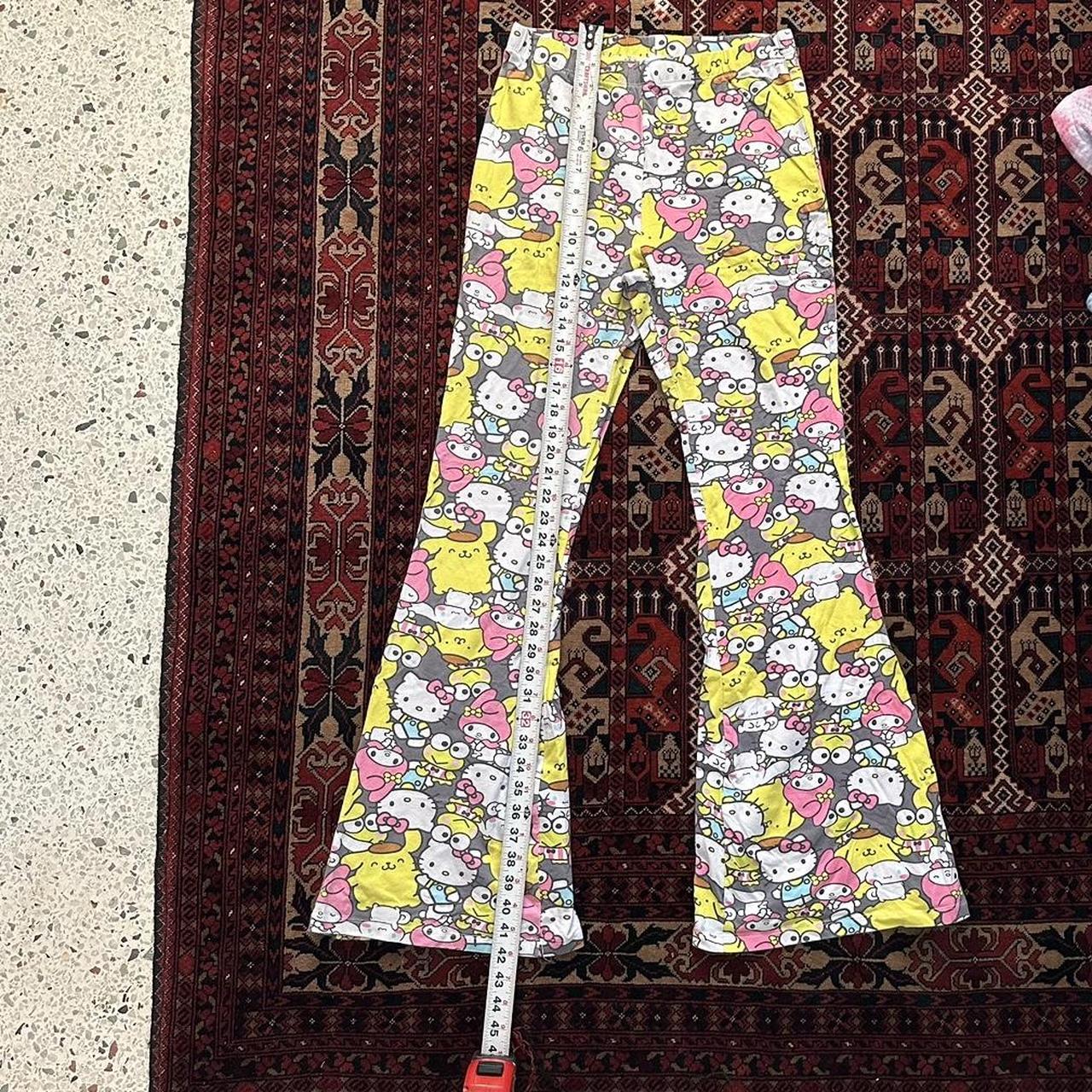 Hello Kitty flare pants size L. Slight pilling in... - Depop