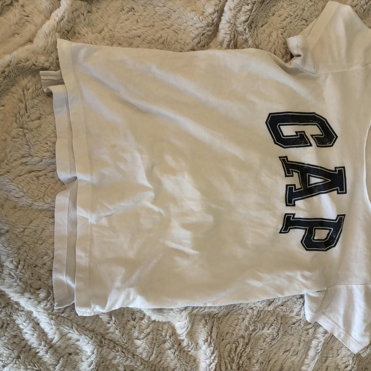 -White with navy lettering GAP off the shoulder... | Depop
