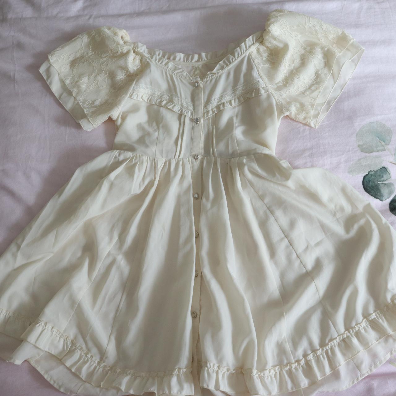 The prettiest lightweight cream dress from axes... - Depop