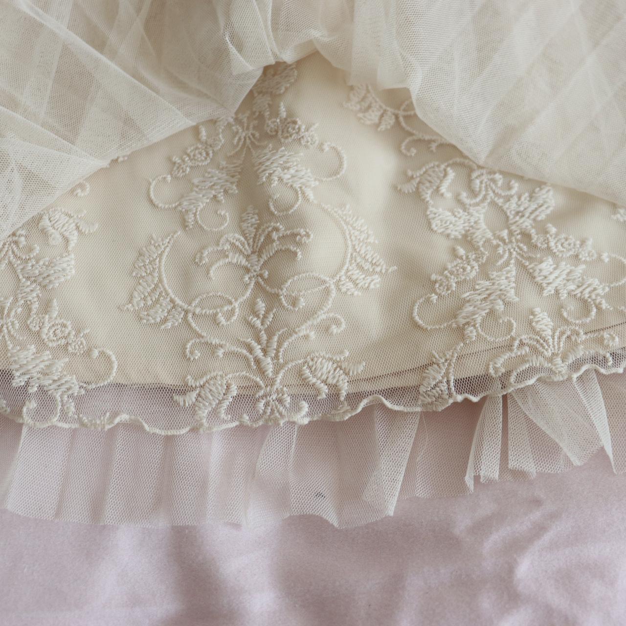 This beige layered tulle and lace skirt from axes... - Depop