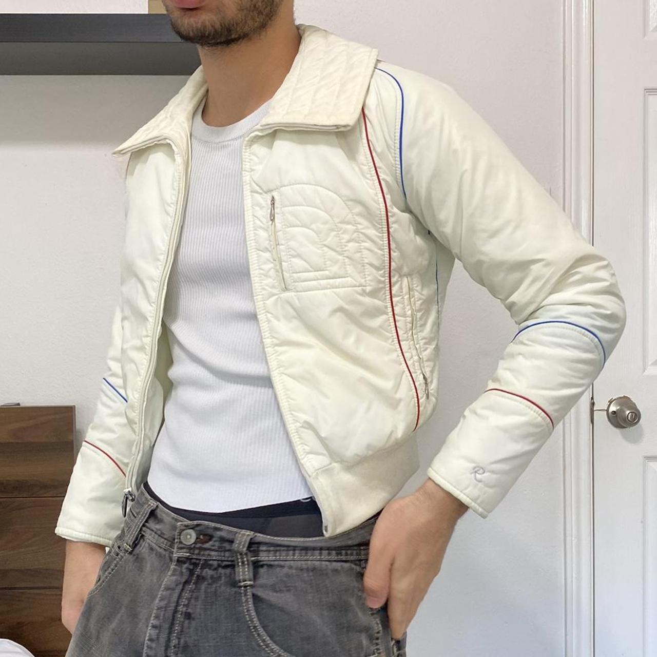 true vintage cream skiing jacket has red and blue... - Depop