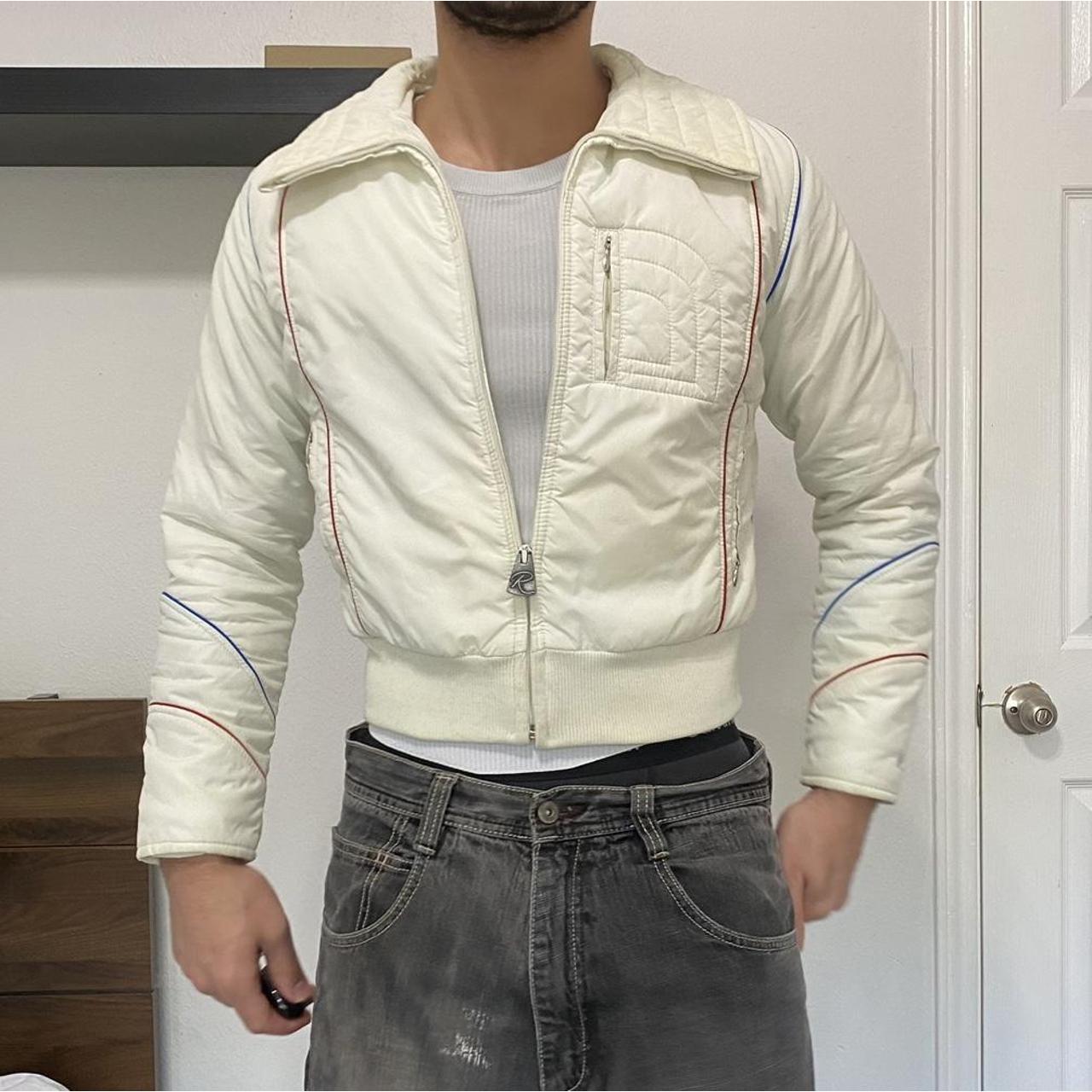 true vintage cream skiing jacket has red and blue... - Depop