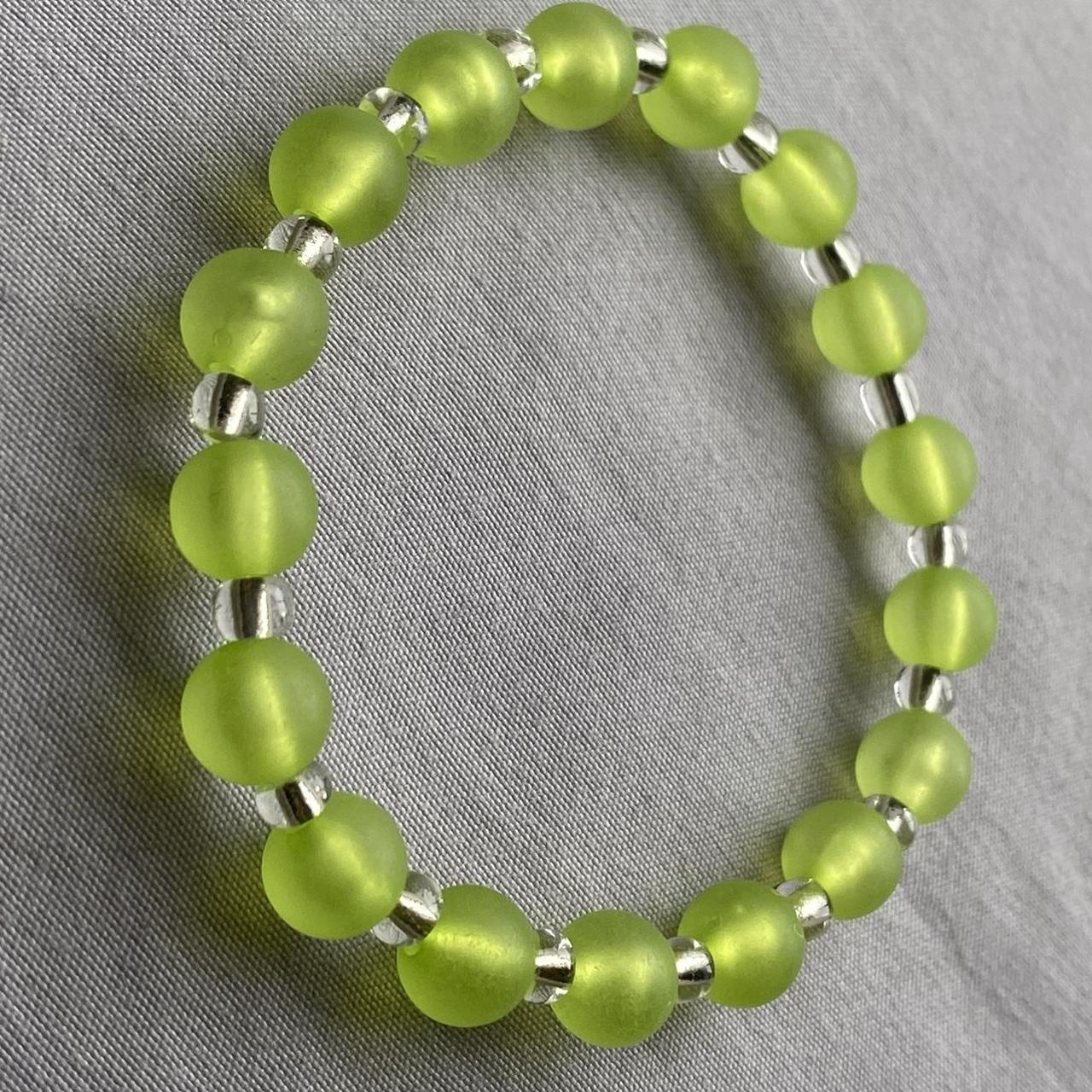 lime green bracelet with shiny highlight... - Depop