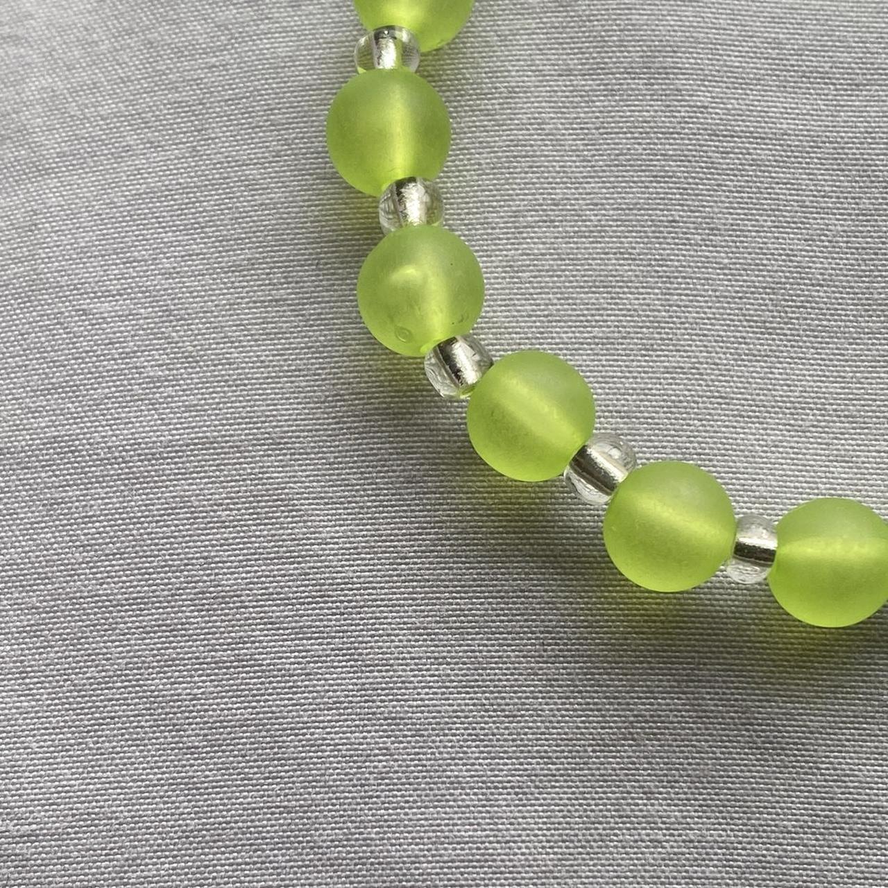lime green bracelet with shiny highlight... - Depop