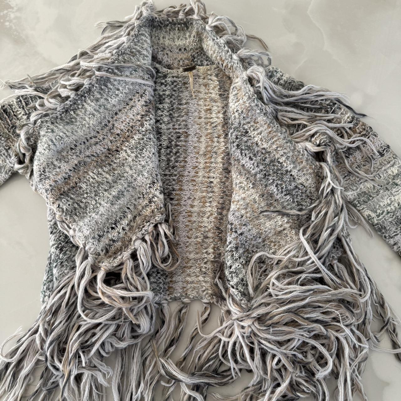 This Free People Design wrap with sleeves is warm &... | Depop