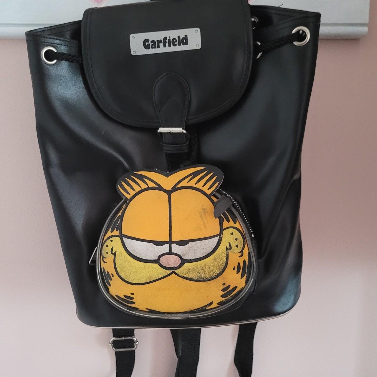 Garfield backpack Pretty worn but all the zippers... - Depop