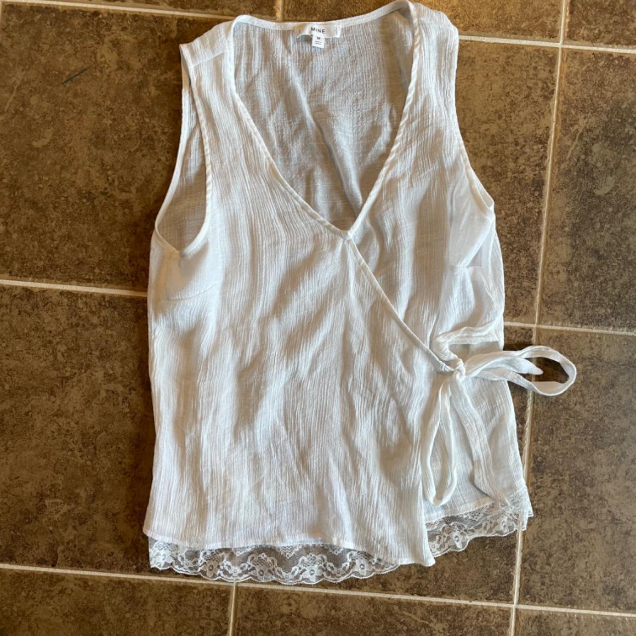 Sleeveless white wrap top with lace detail on... | Depop