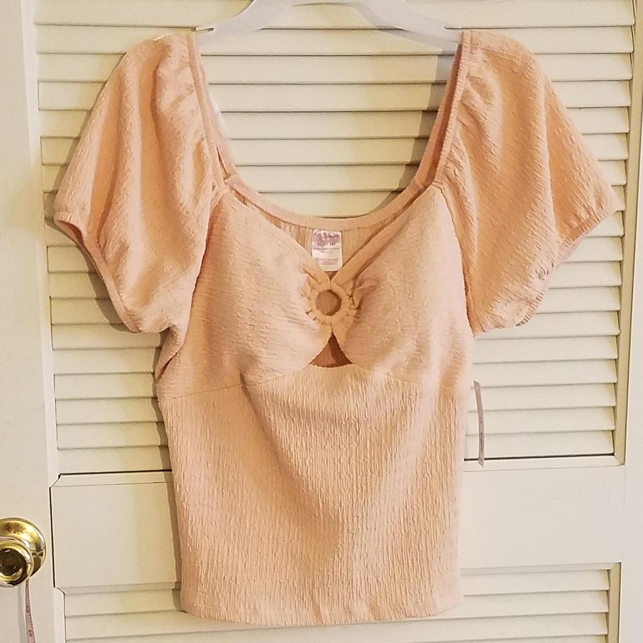 Cute peach colored shirt. It has some stretch to it... - Depop