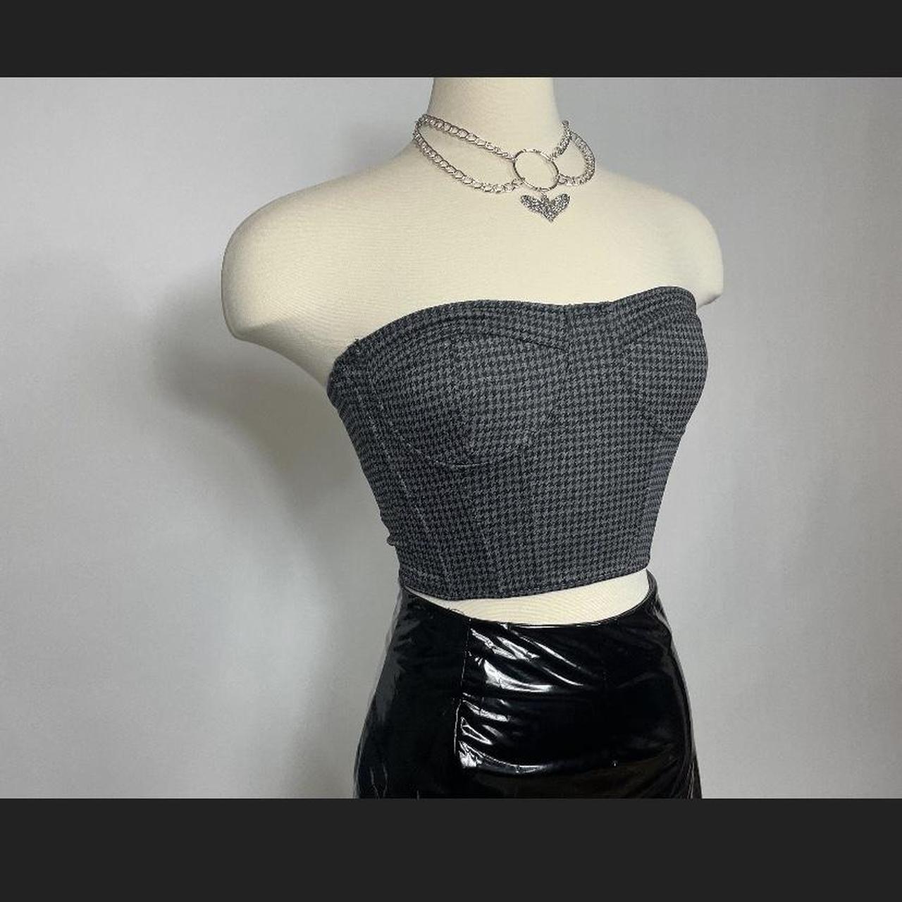 A black plaid corset tube top is a stylish and... - Depop