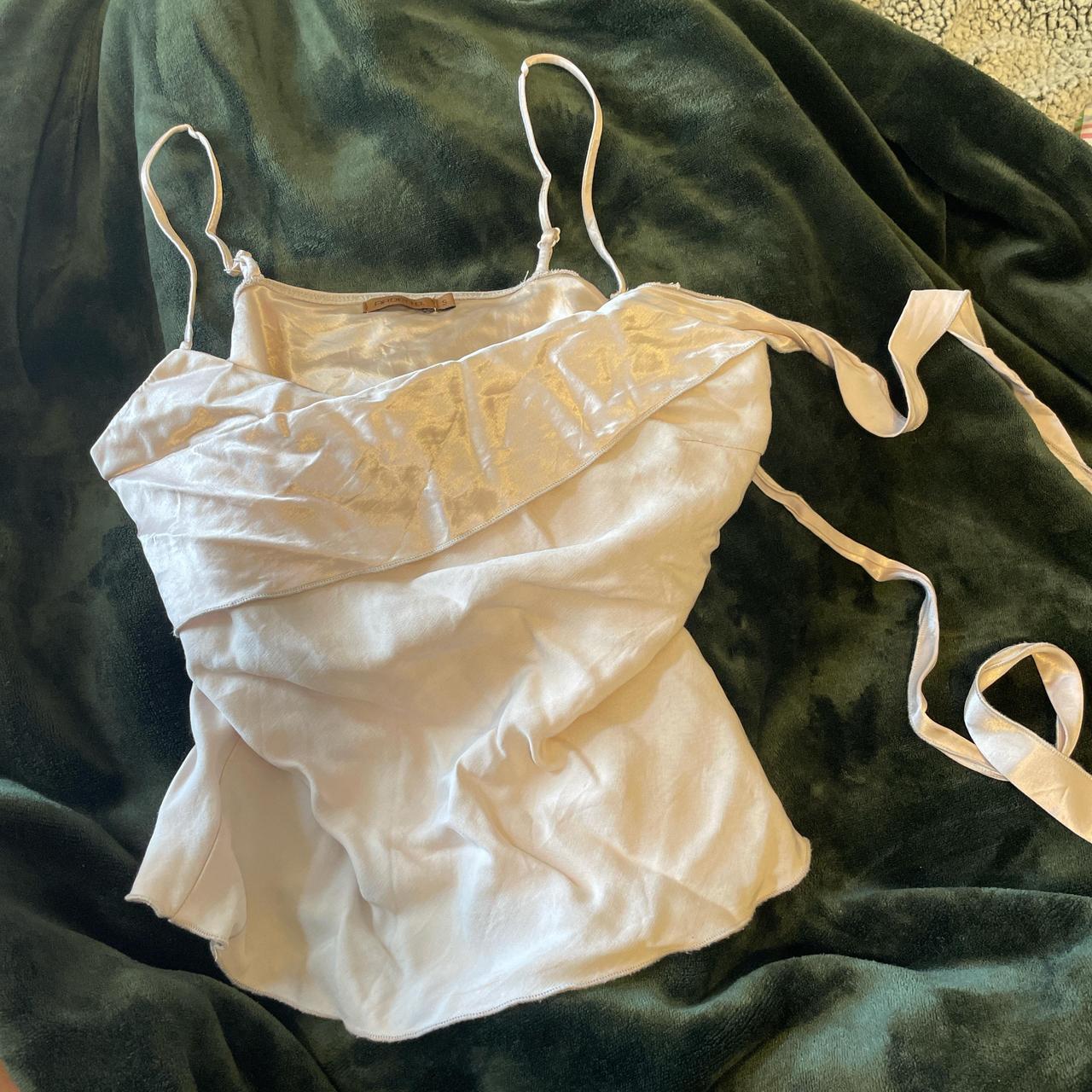 Baby pink tank top with a side tie Droopy front... - Depop