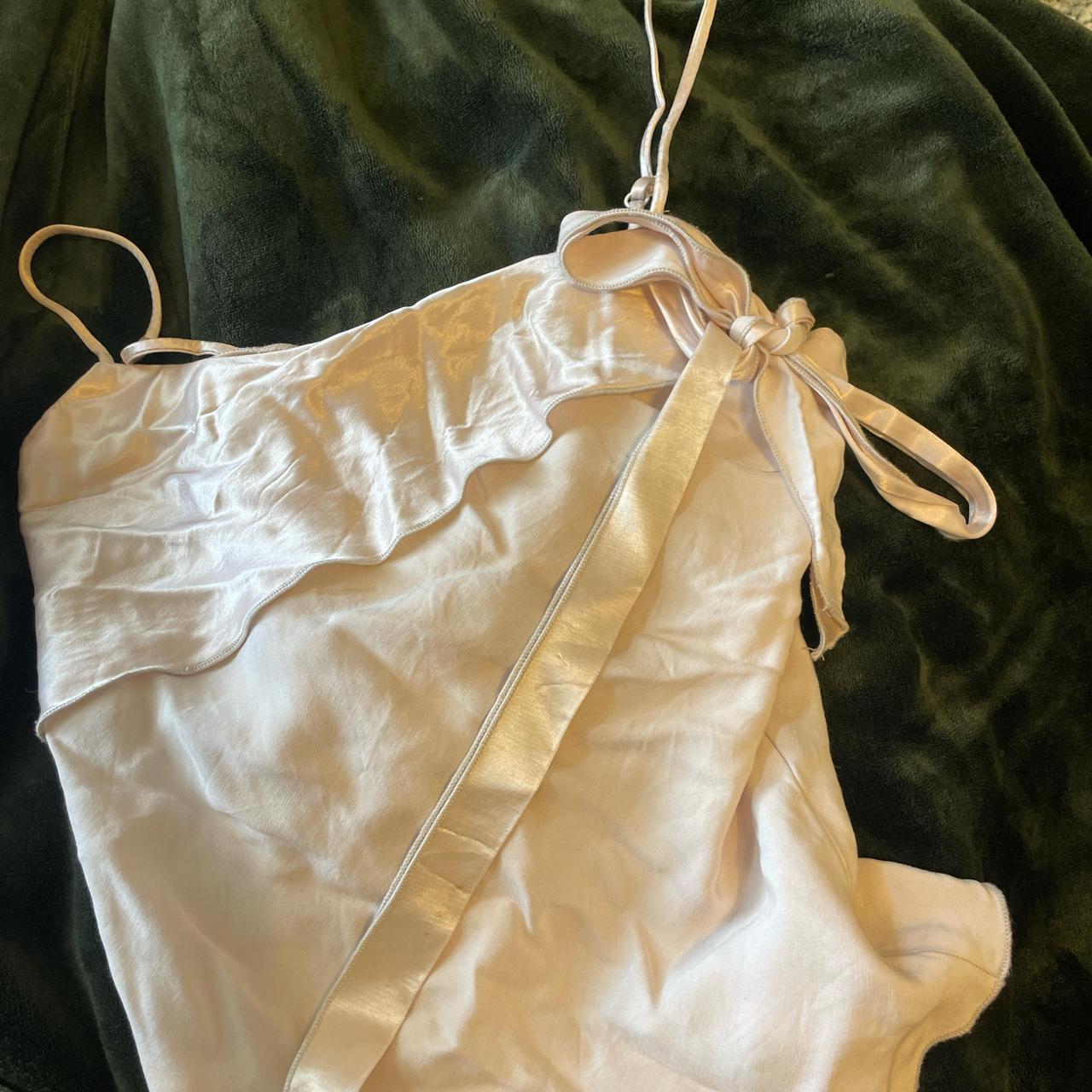 Baby pink tank top with a side tie Droopy front... - Depop