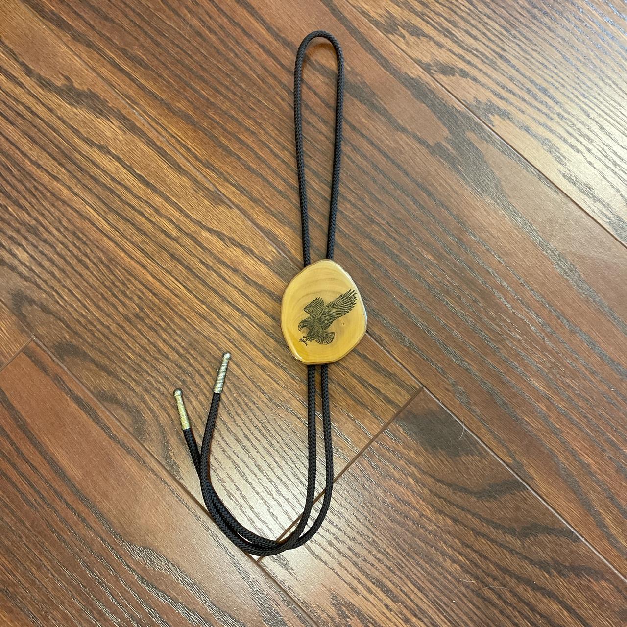 Vintage lacquered wood bolo tie with hawk detailing.... - Depop