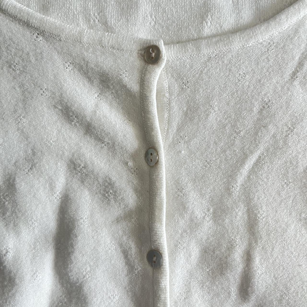 cute white cardigan with little detailing size... - Depop