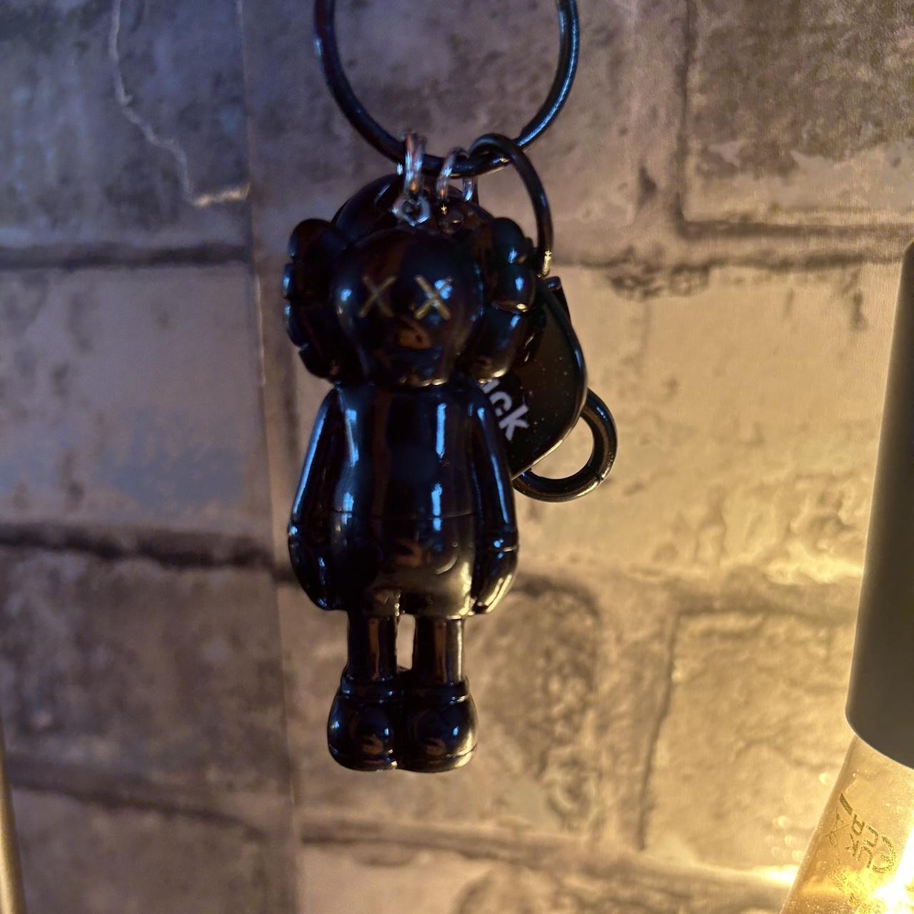 black kaws keychain brand new in packaging - Depop