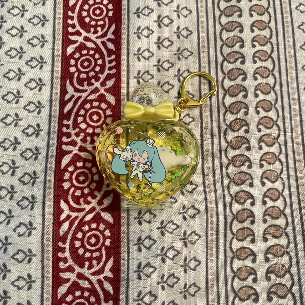 Yellow Hatsune Miku perfume bottle keychain... | Depop