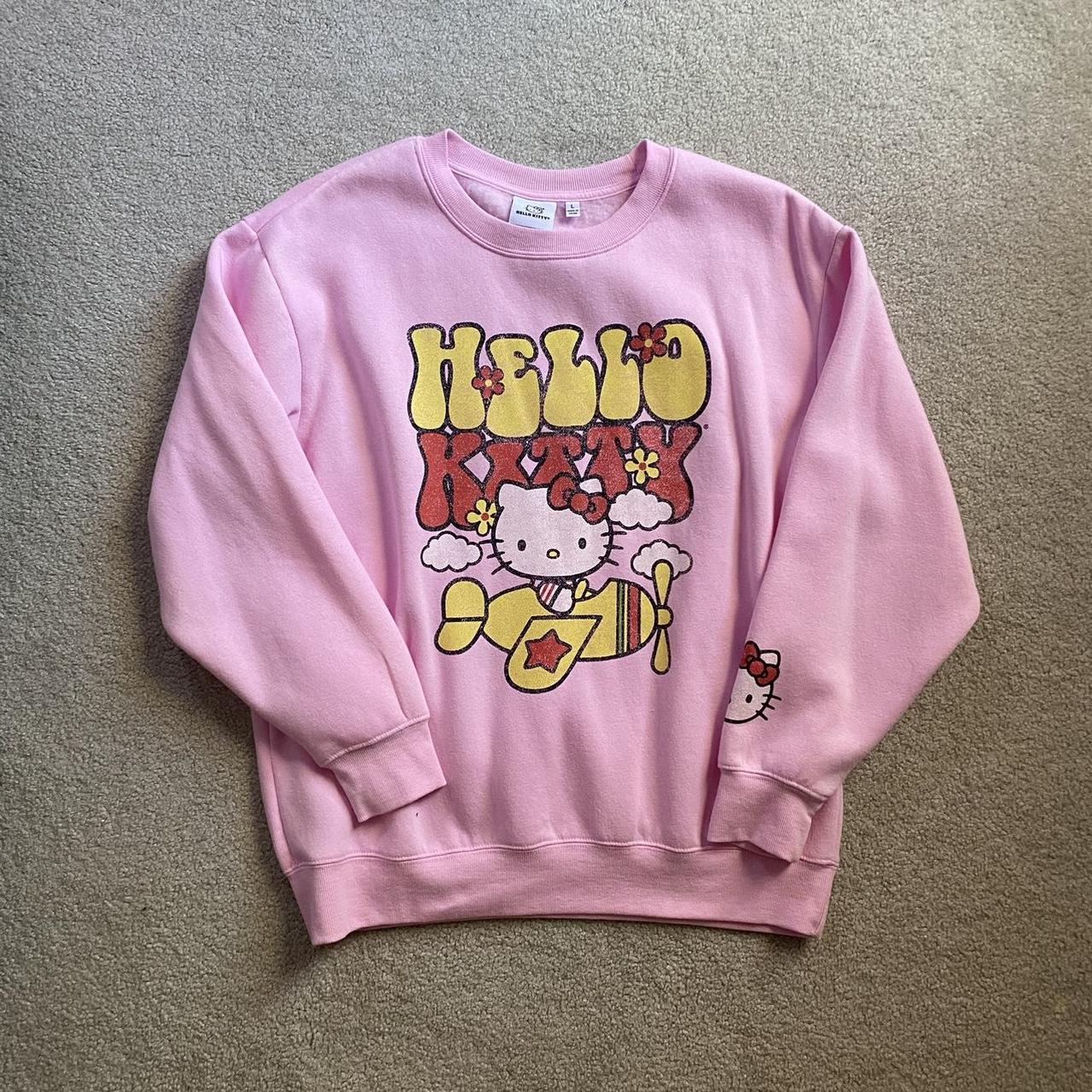 Pink Hello Kitty sweater! Never worn, but print has... - Depop