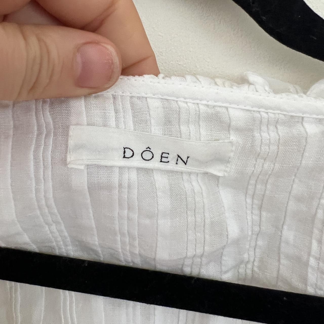 Doen top with black accent buttons Never Worn... - Depop