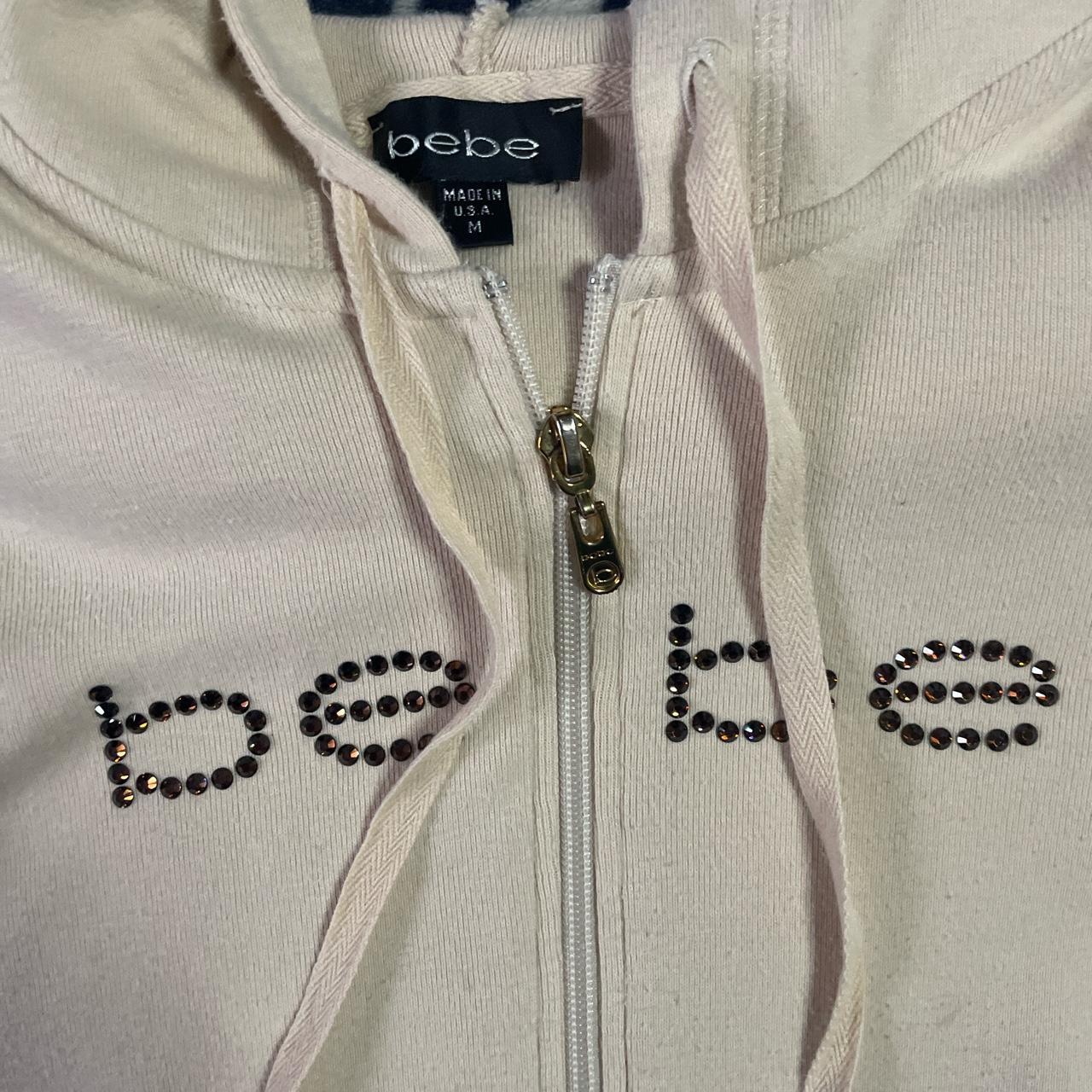 Cute Bebe mini zip up peachy pink color - Depop