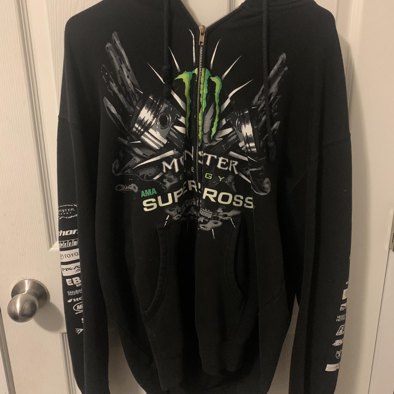 Monster black zip up with designs on the sleeves... - Depop