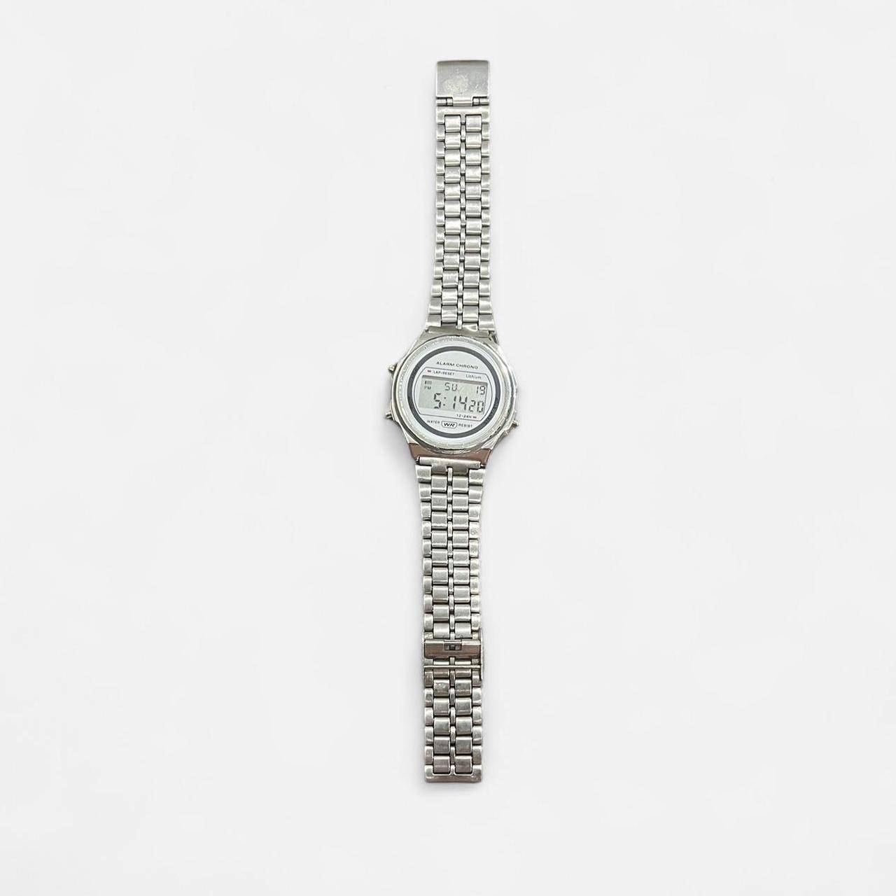 Silver analogue watch with a classic, minimalist... | Depop