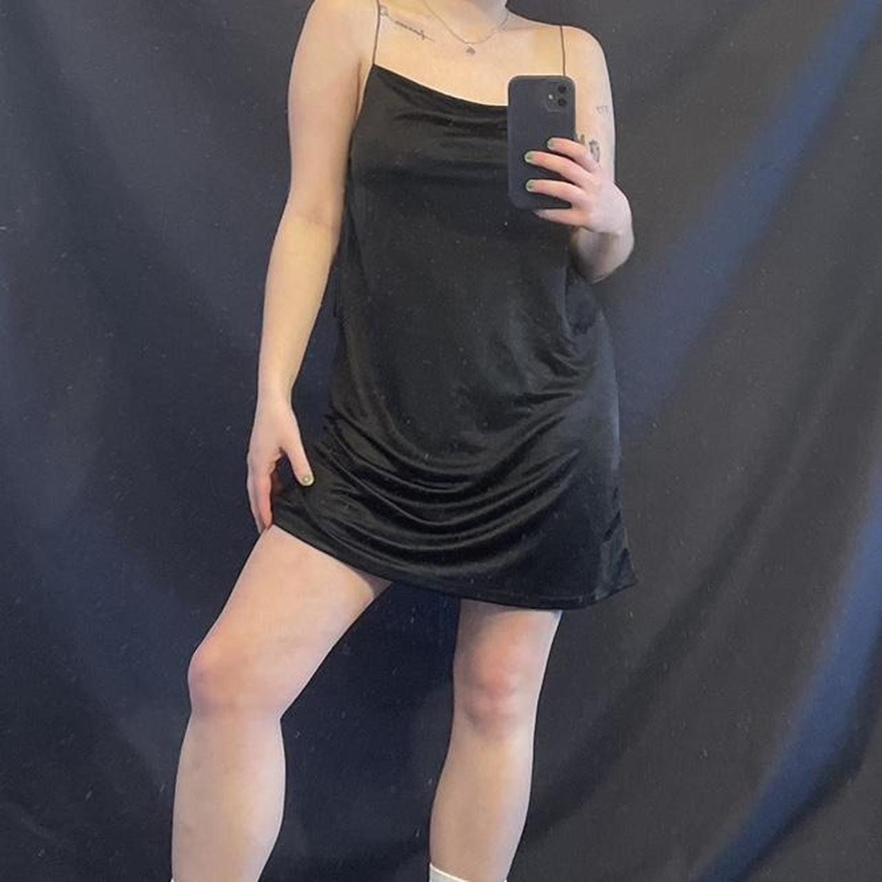 floaty black spaghetti strap mini slip dress has a... | Depop