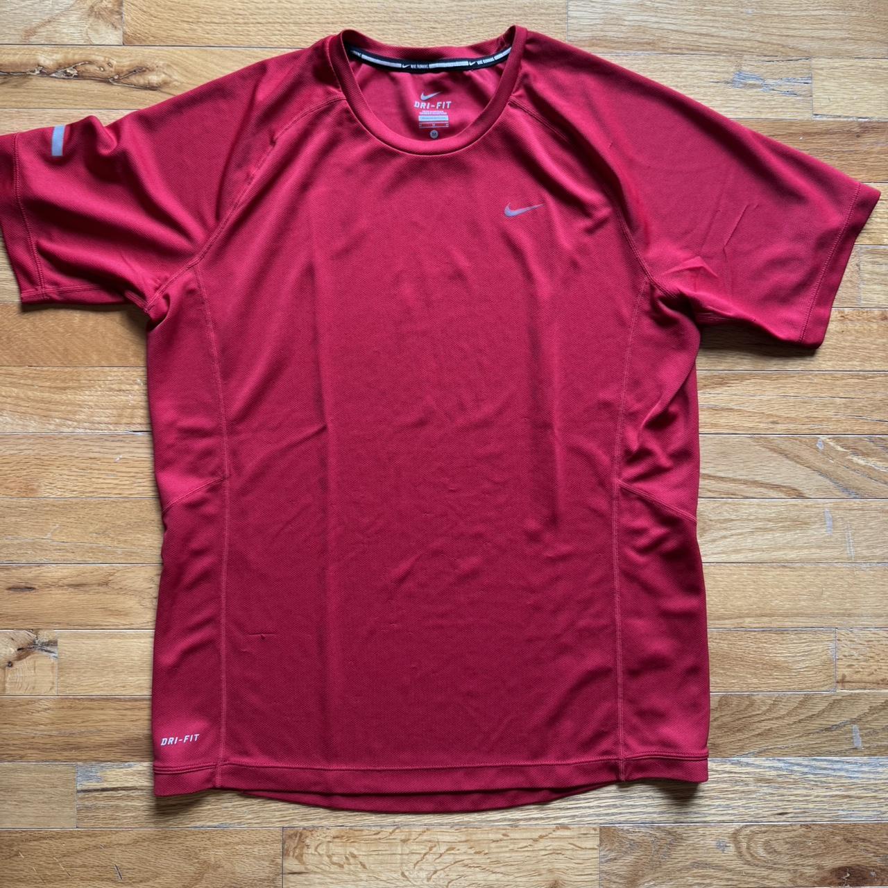 Red Nike Dri-Fit T-shirt Frayed in the front... | Depop