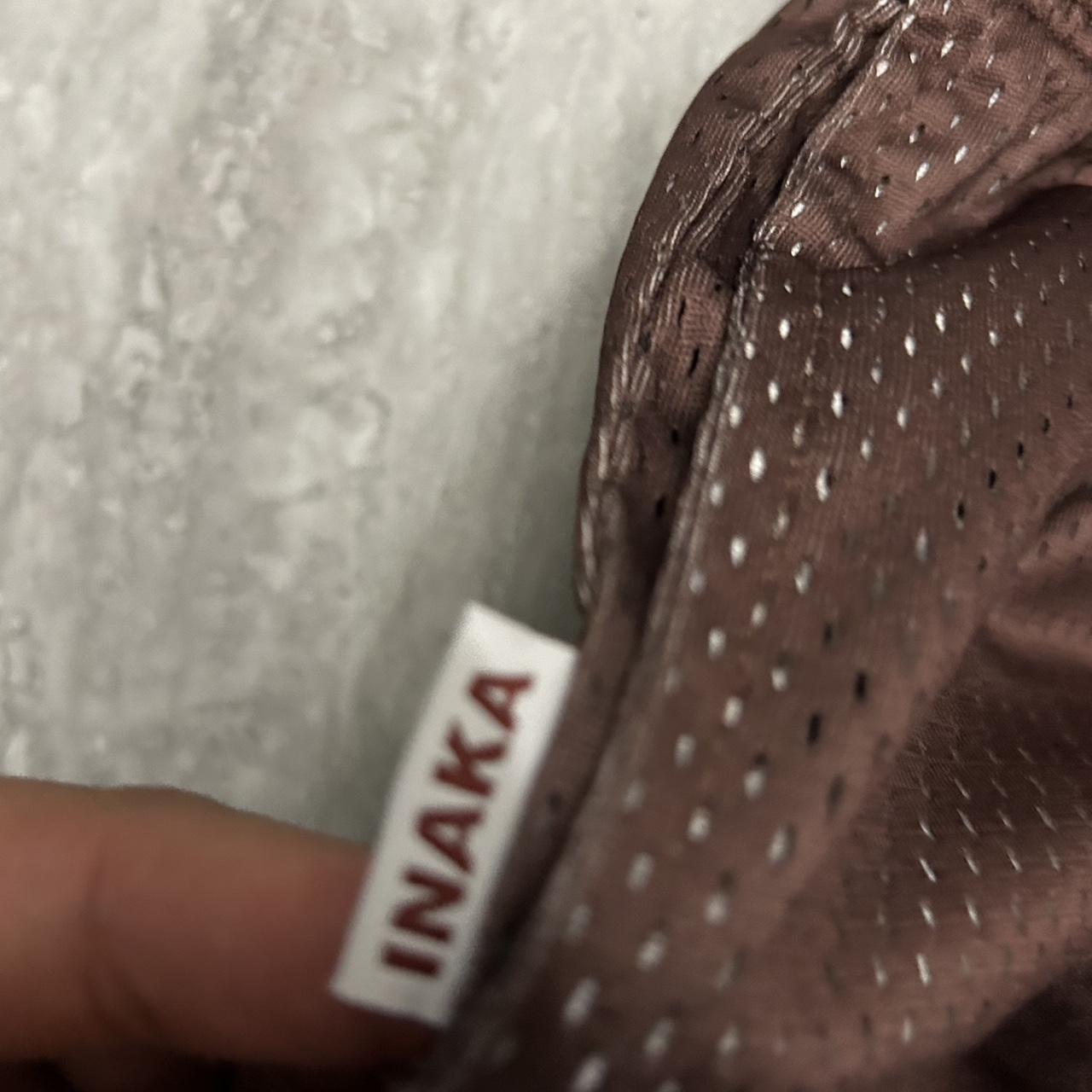 Brown Inaka power shorts size M - Depop