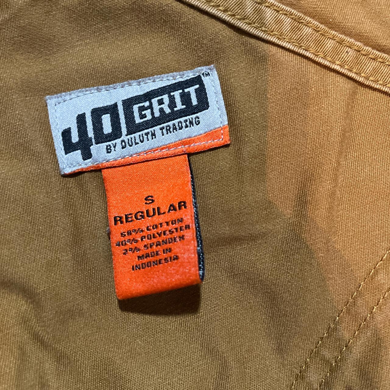 Tan Duluth carpenter style overalls with a relaxed... | Depop