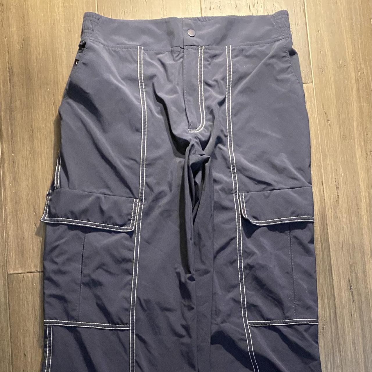 Athleta navy blue cargo pants with white stitching... - Depop