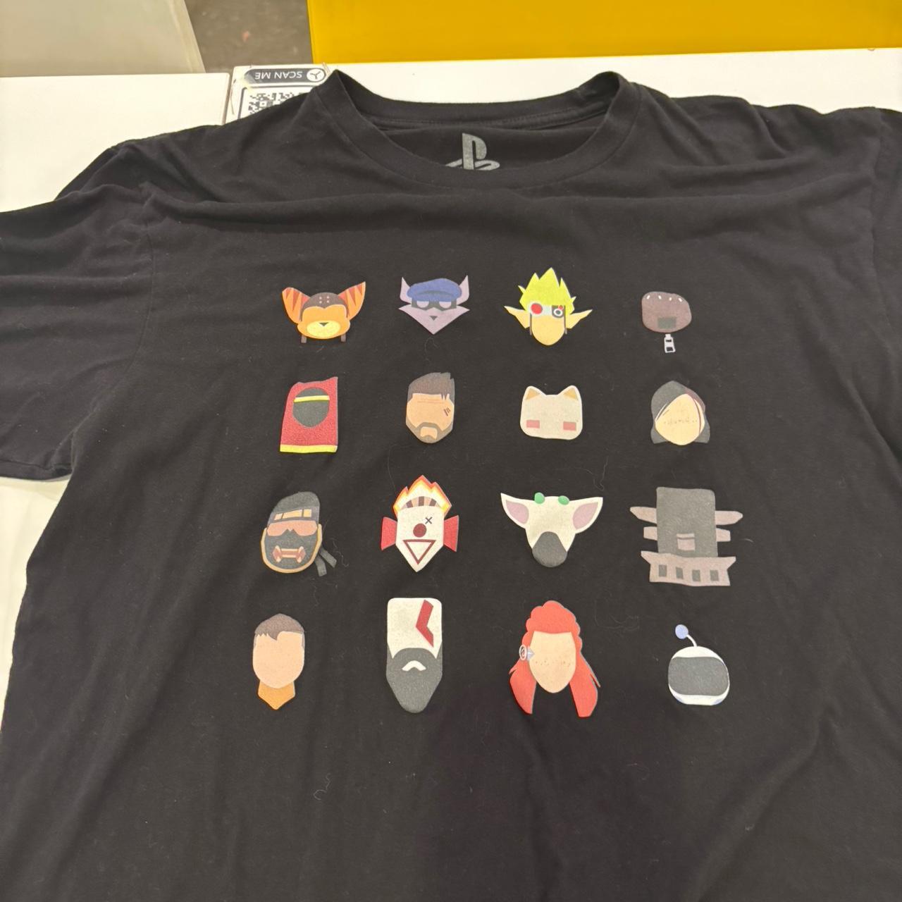 Black PlayStation branded 20th Anniversary tee size... | Depop