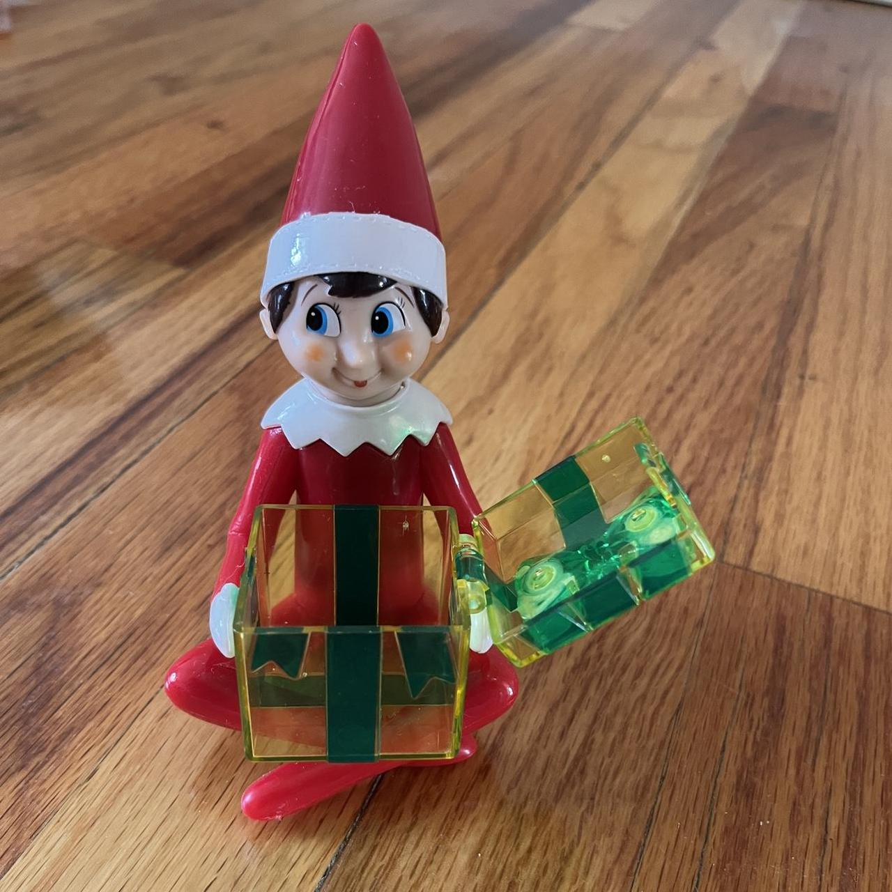 Elf on the shelf plastic toy holding empty gift box... - Depop
