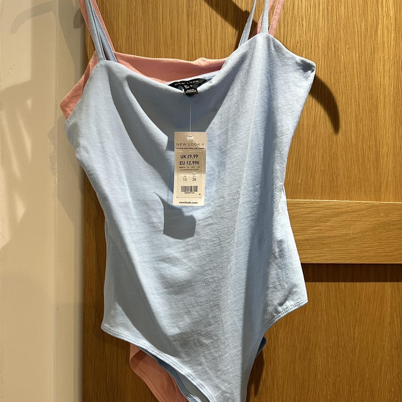 Set of two Blue & pink body suits Newlook Never... - Depop