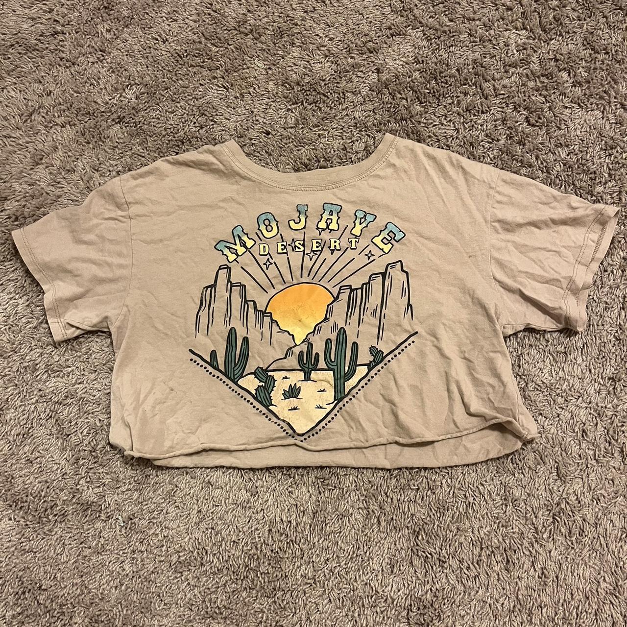 large tan cropped graphic tee, fits like a small or... - Depop