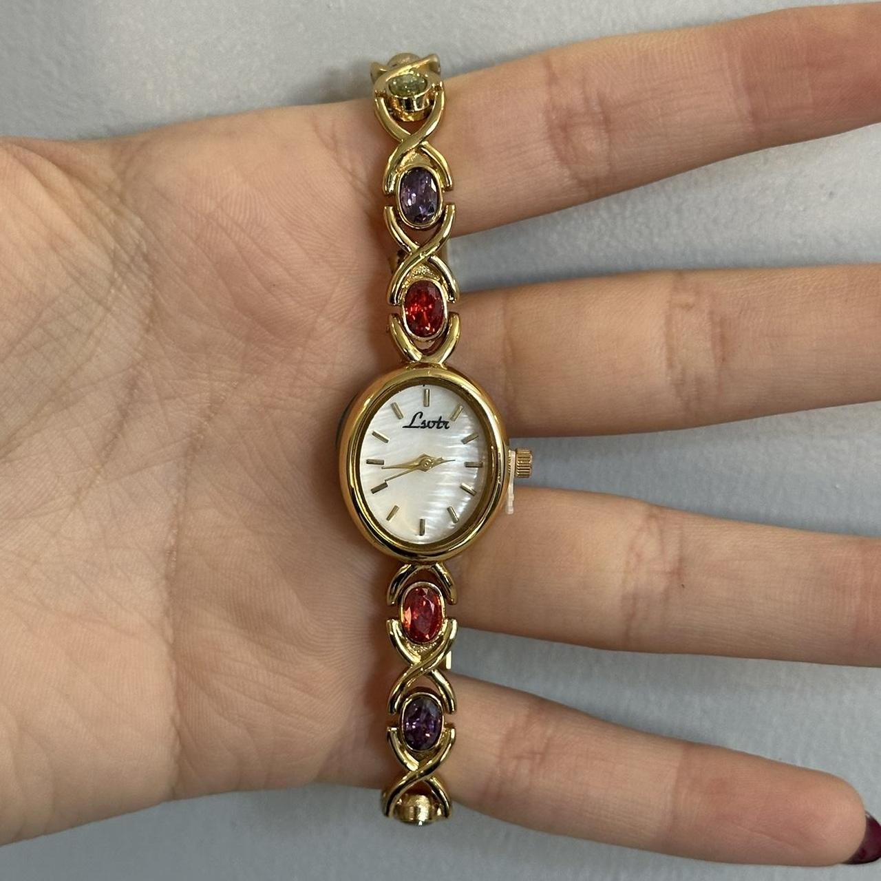 gold watch with multi colored stones/gems! working!... | Depop