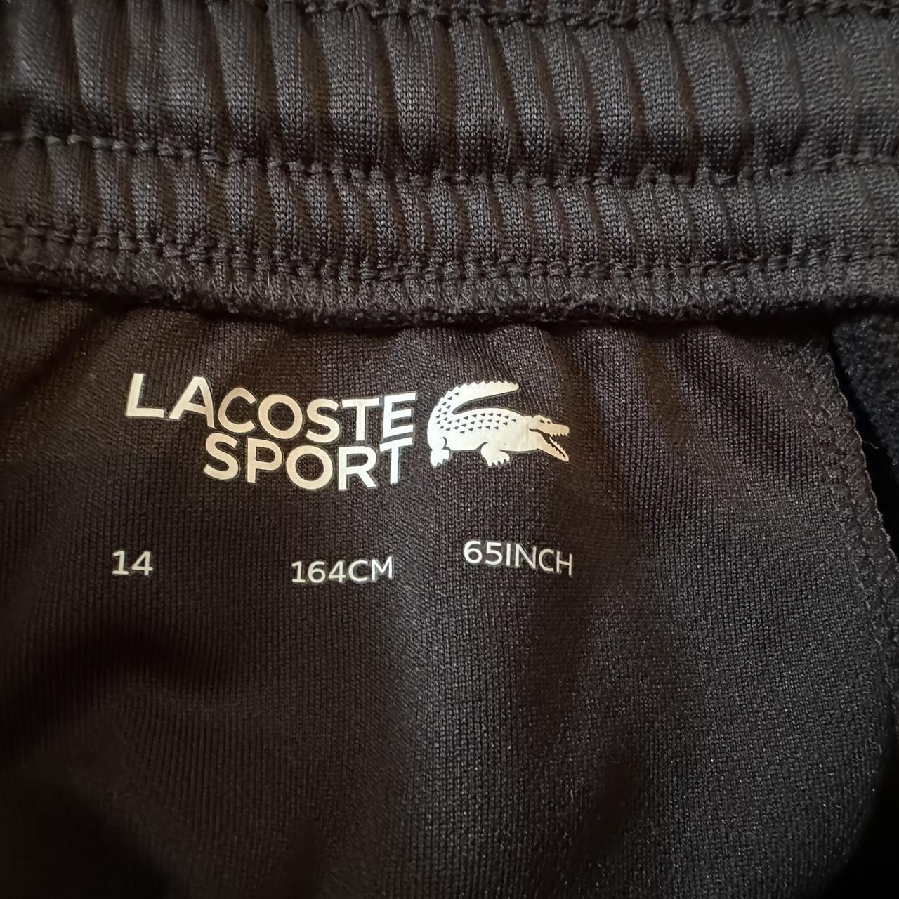 Lacoste black tracksuit bottoms. Great condition in... - Depop