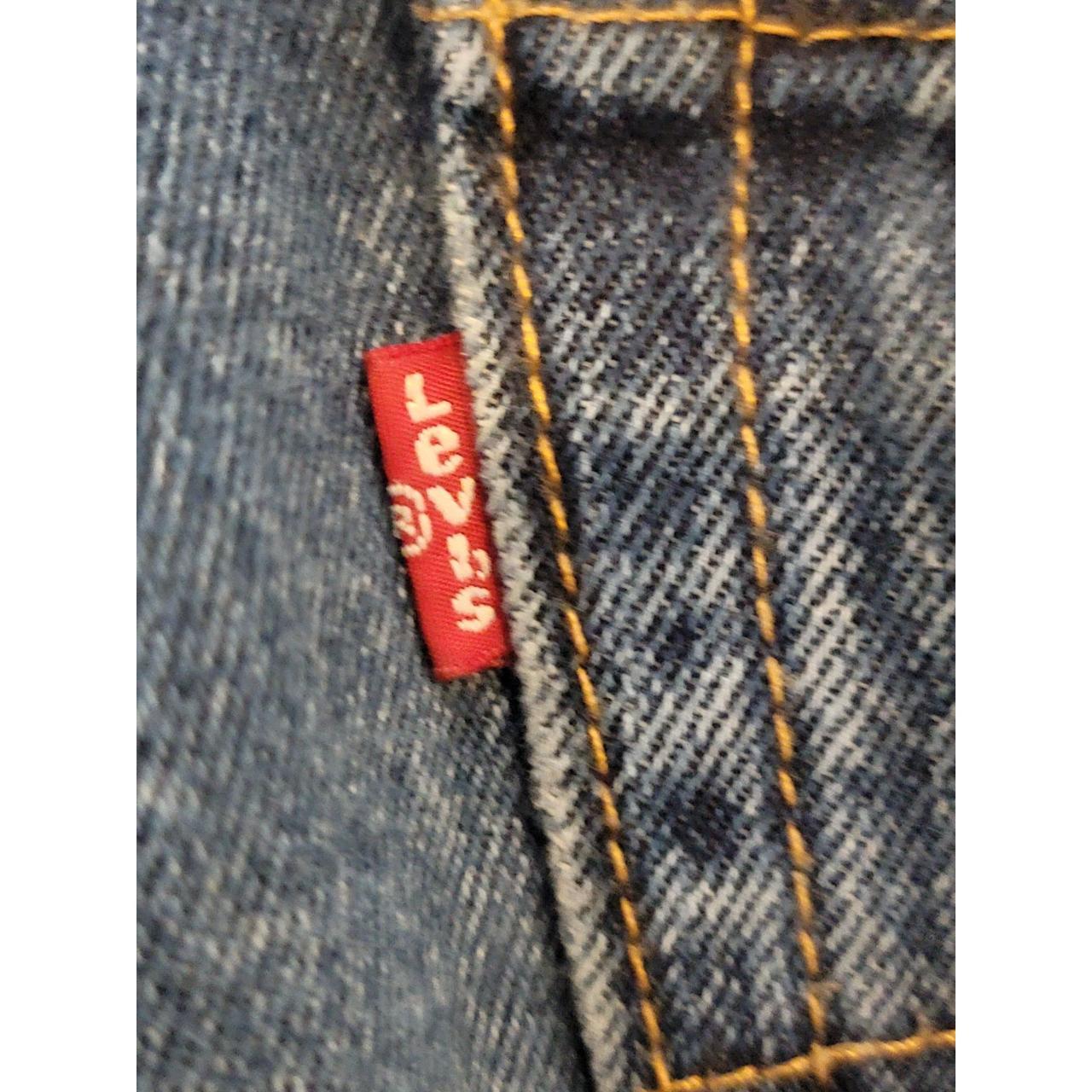 These Levi's 505 jeans offer a classic straight-leg... - Depop