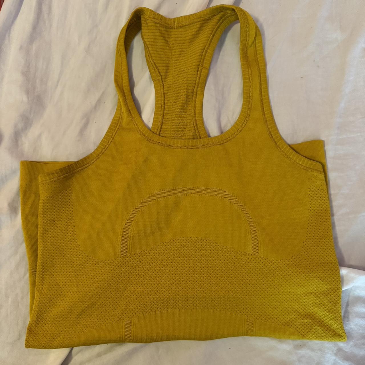 yellow lululemon tank size 4 worn once - Depop