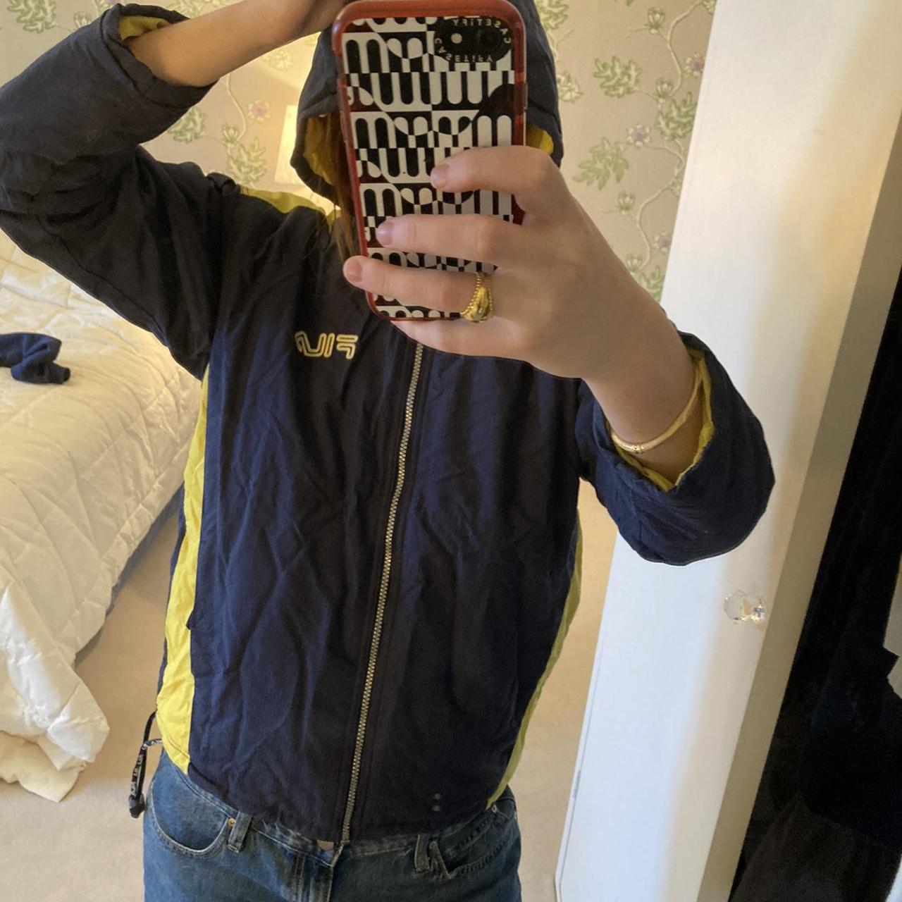 Super cool blue yellow Fila warm jacket with... - Depop
