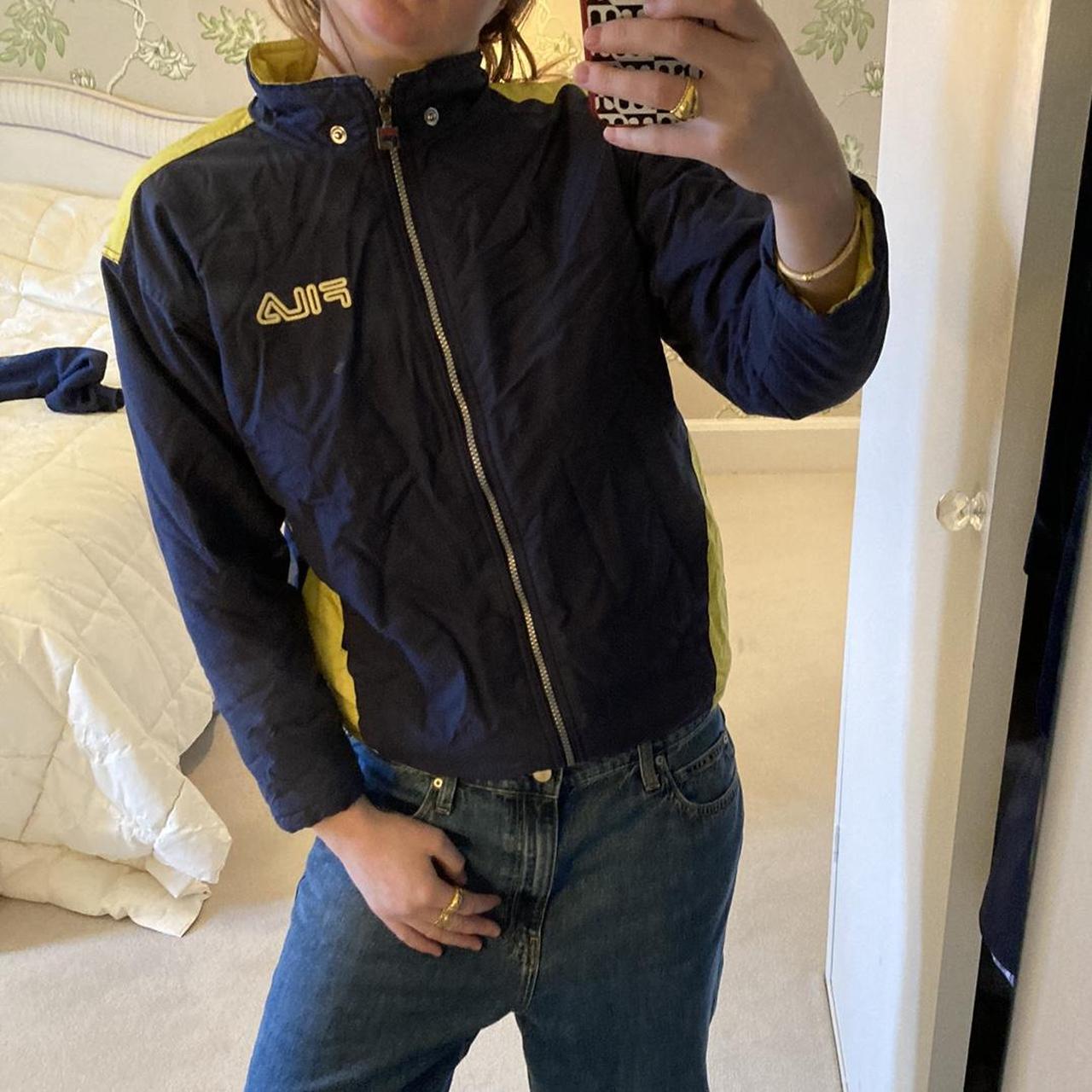 Super cool blue yellow Fila warm jacket with... - Depop