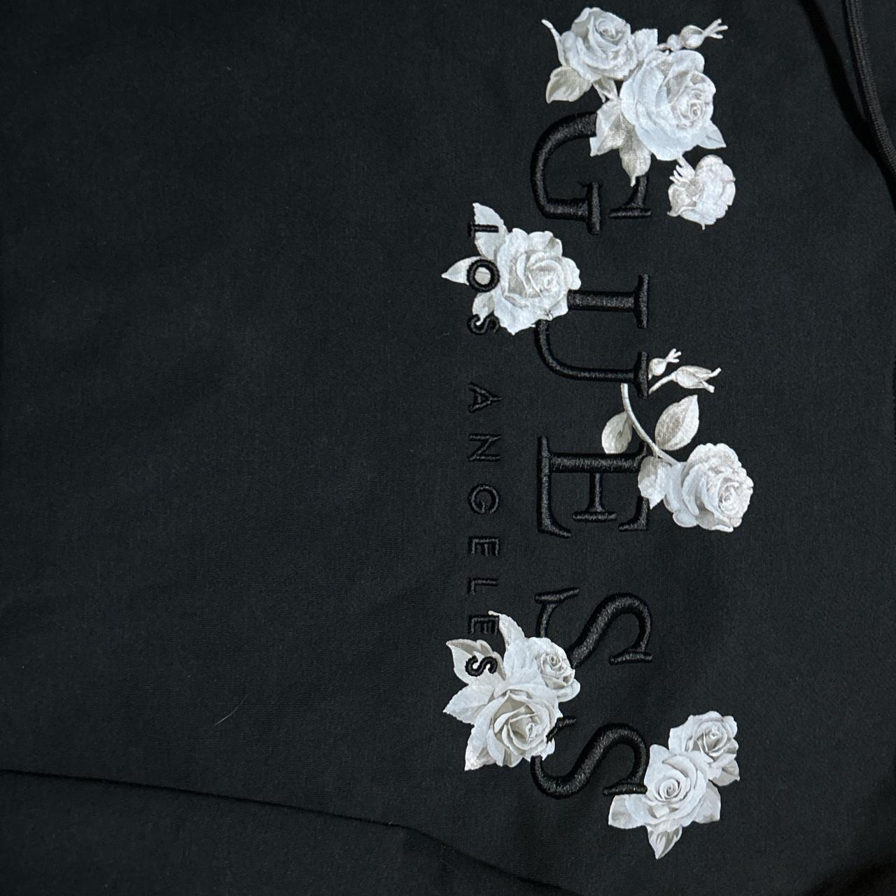 Black GUESS hoodie with white roses. Good for... - Depop